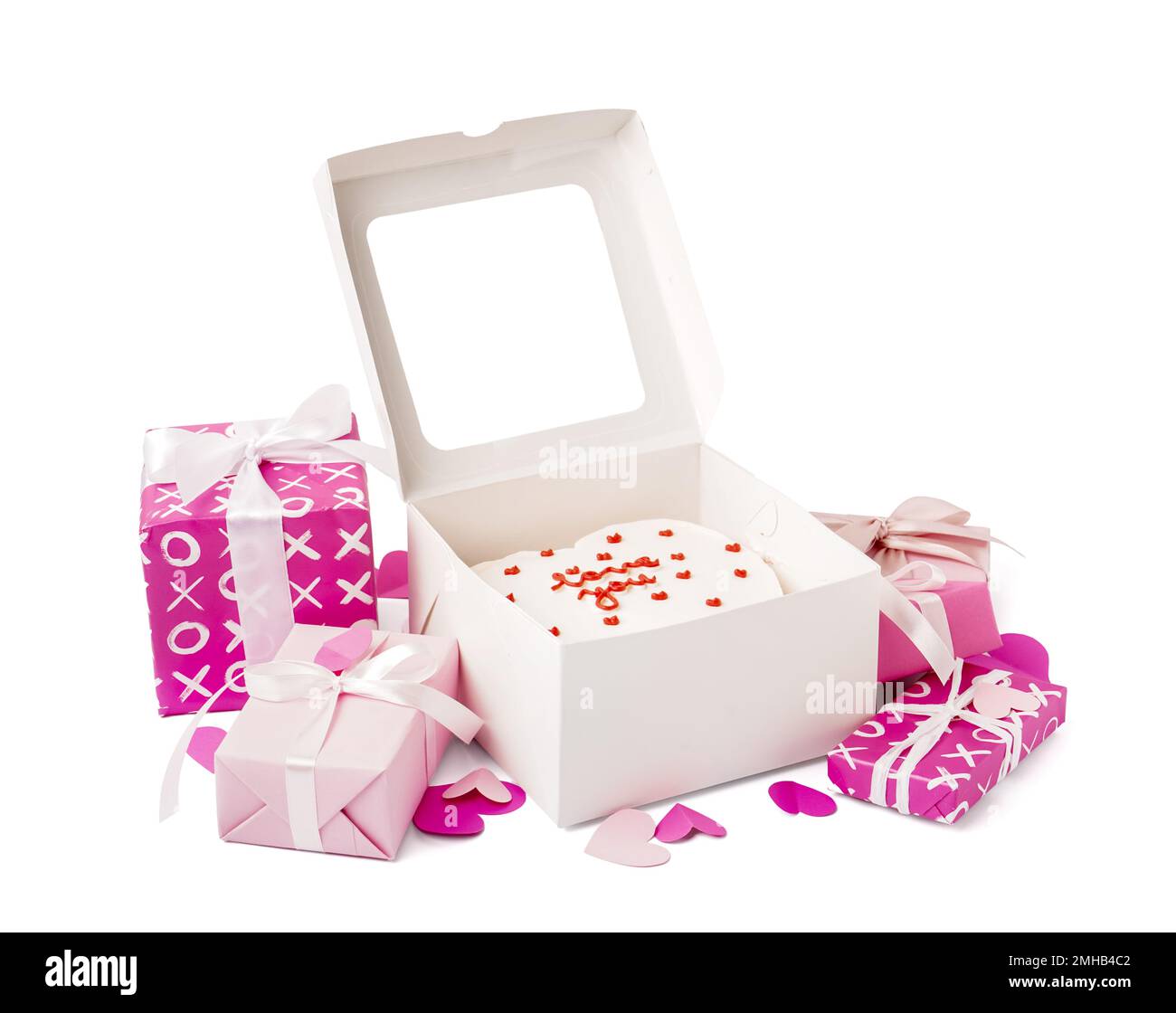 Box with tasty bento cake, gifts and hearts isolated on white ...