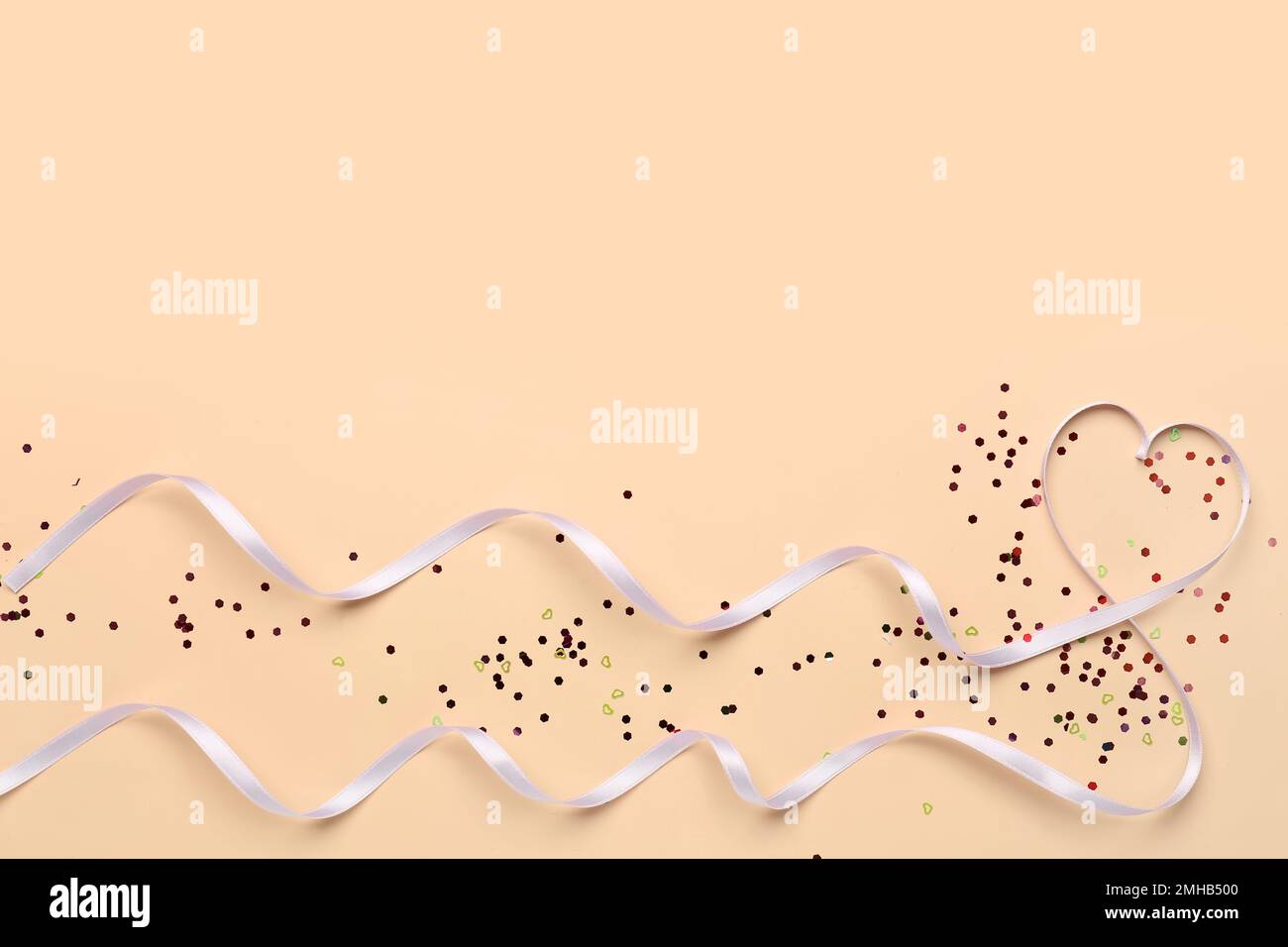 Heart made of white satin ribbon on beige background. Valentine's Day ...