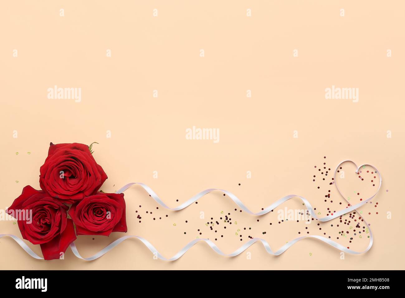 Rose flowers and heart made of white satin ribbon on beige background ...