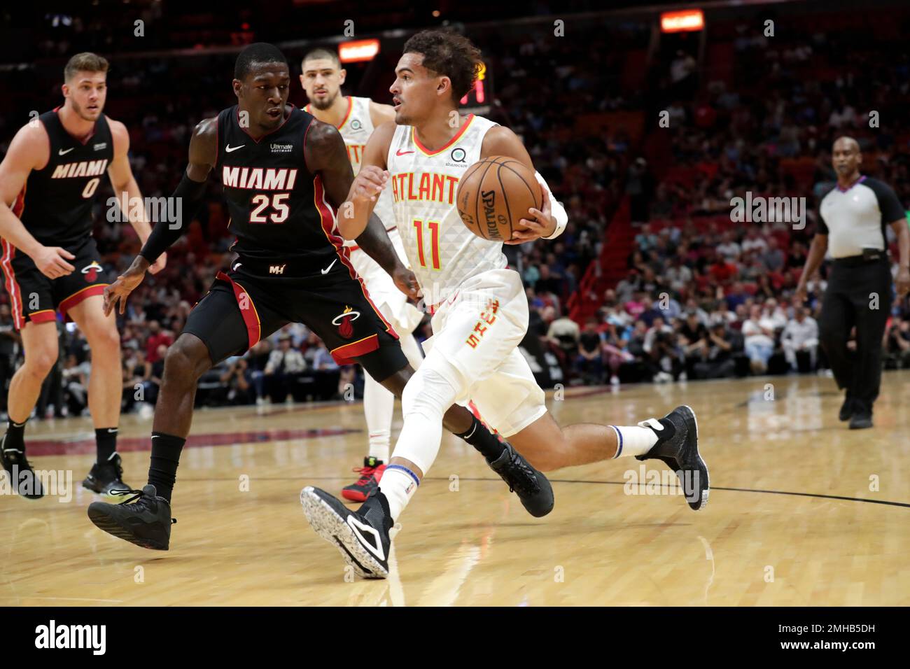 Atlanta Hawks guard Trae Young (11) drives to the basket as Miami Heat ...