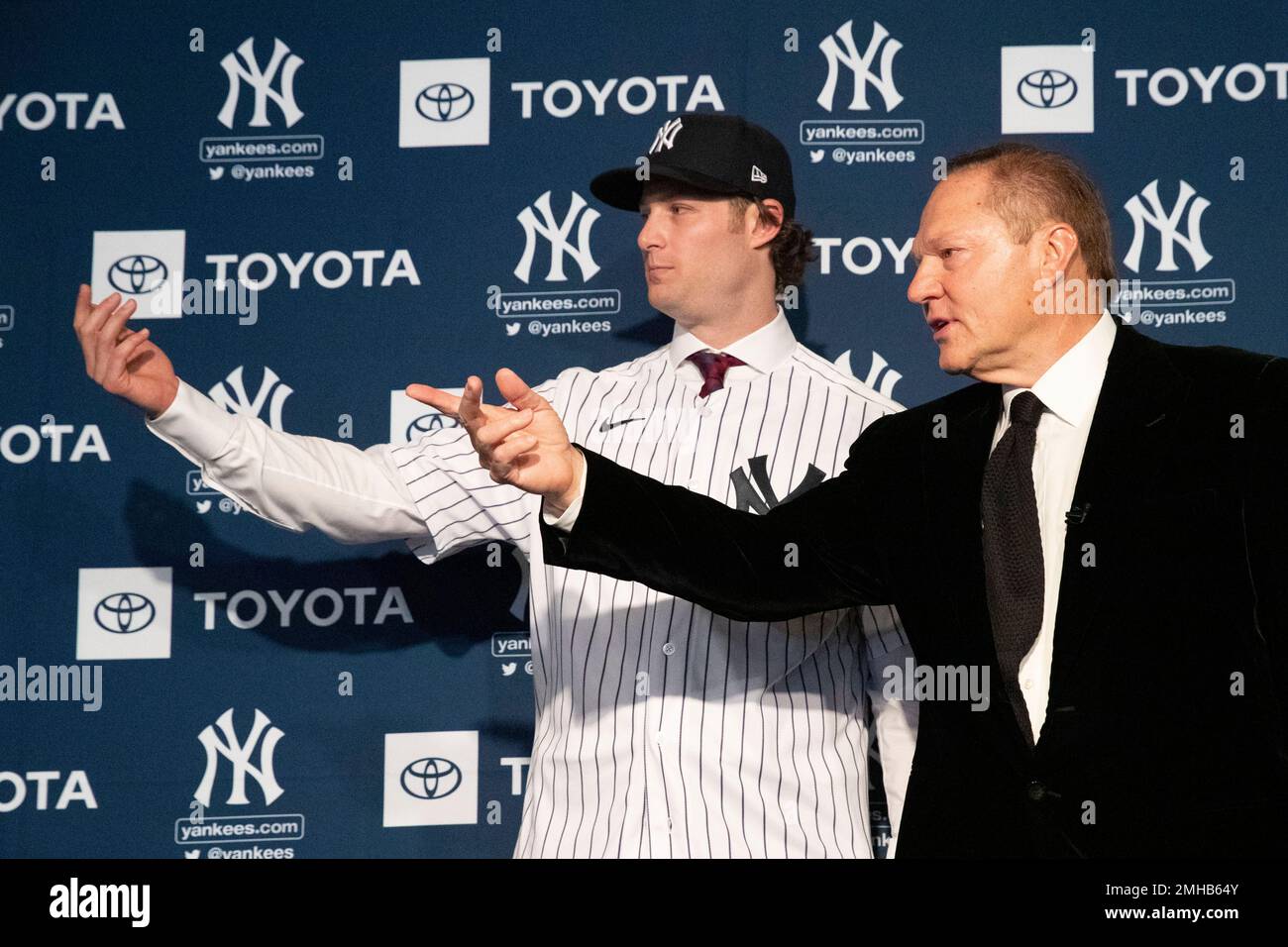 Gerrit Cole, left, and his agent Scott Boras gesture as he is ...