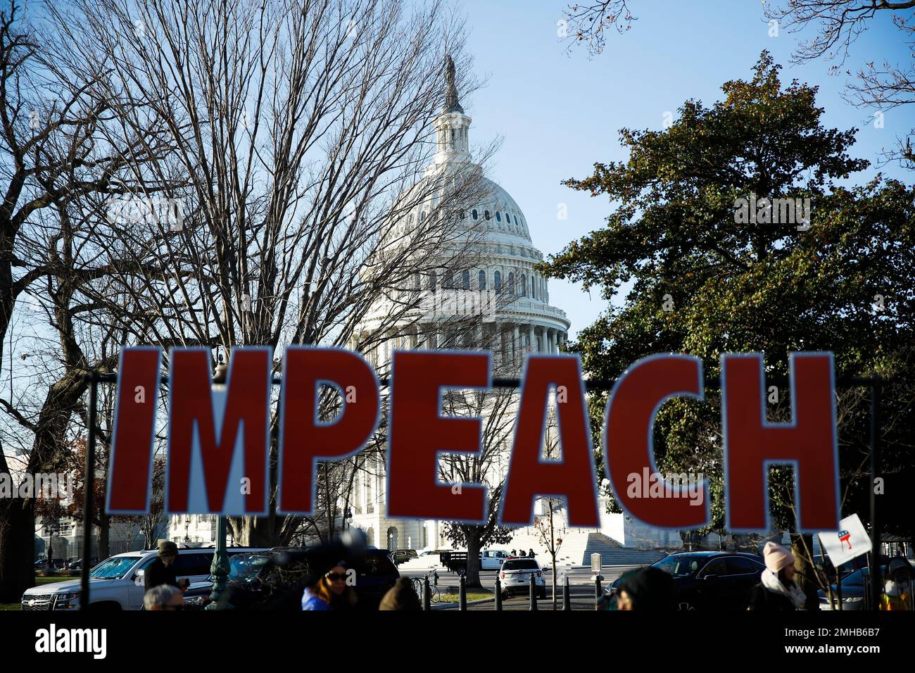 Protesters demonstrate as the House of Representatives begins debate on ...