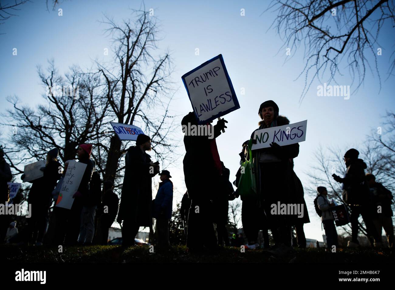 Protesters demonstrate as the House of Representatives begins debate on ...