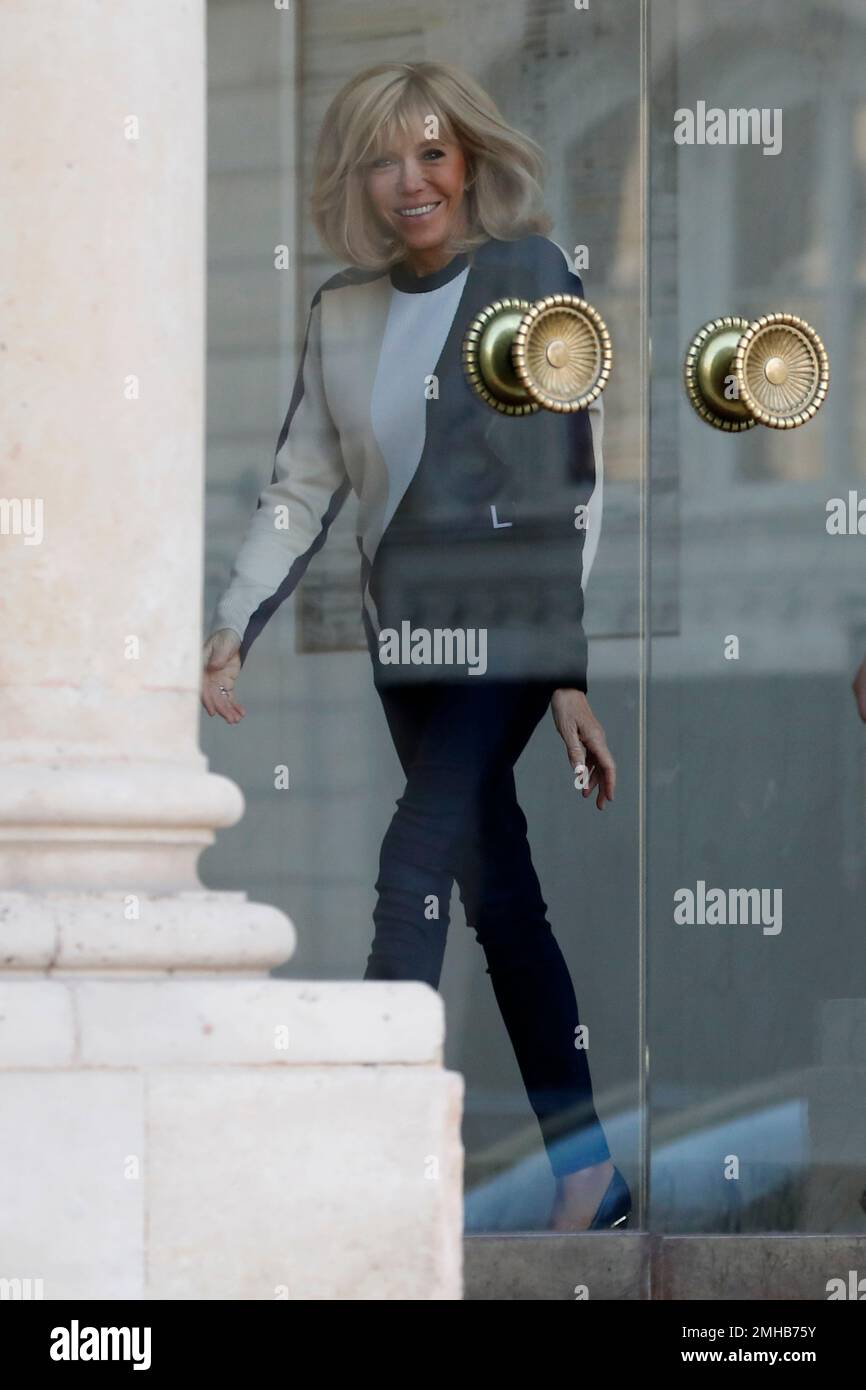 French President Emmanuel Macron's wife Brigitte Macron walks past the ...