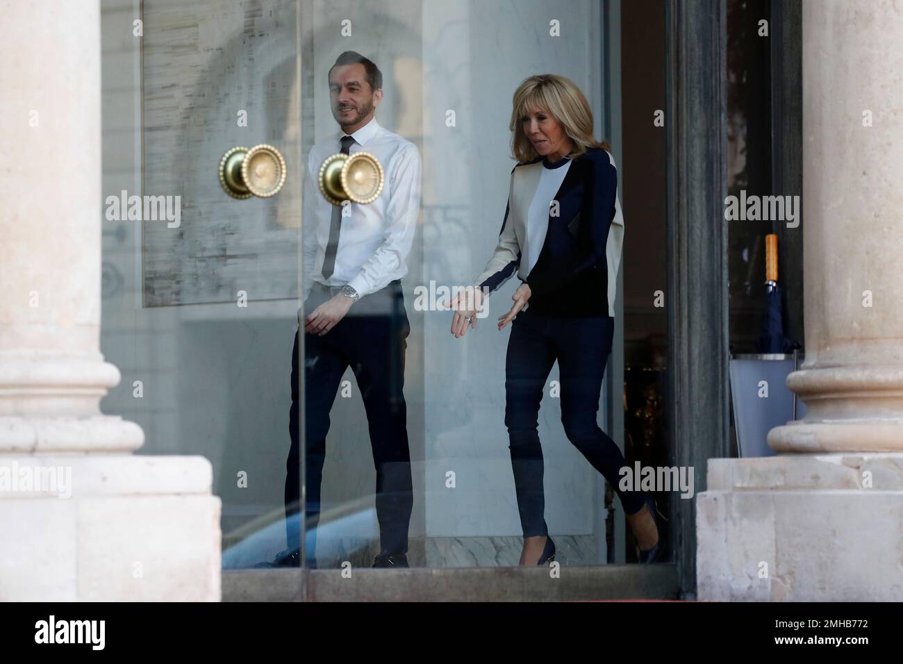 French President Emmanuel Macron's wife Brigitte Macron, gesture while ...