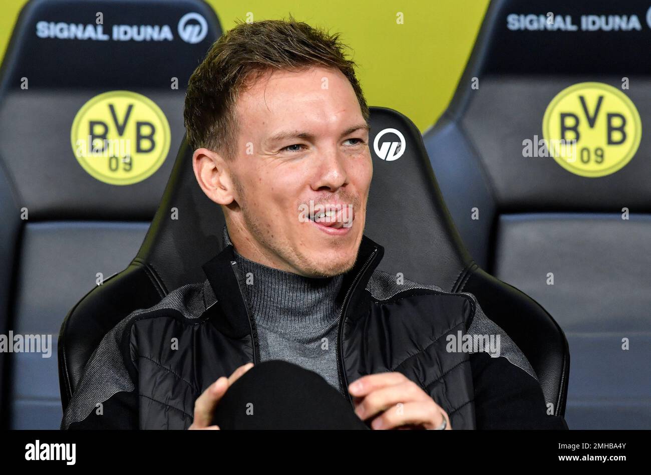 Leipzig's manager Julian Nagelsmann smiles on a Borussia seat prior the ...