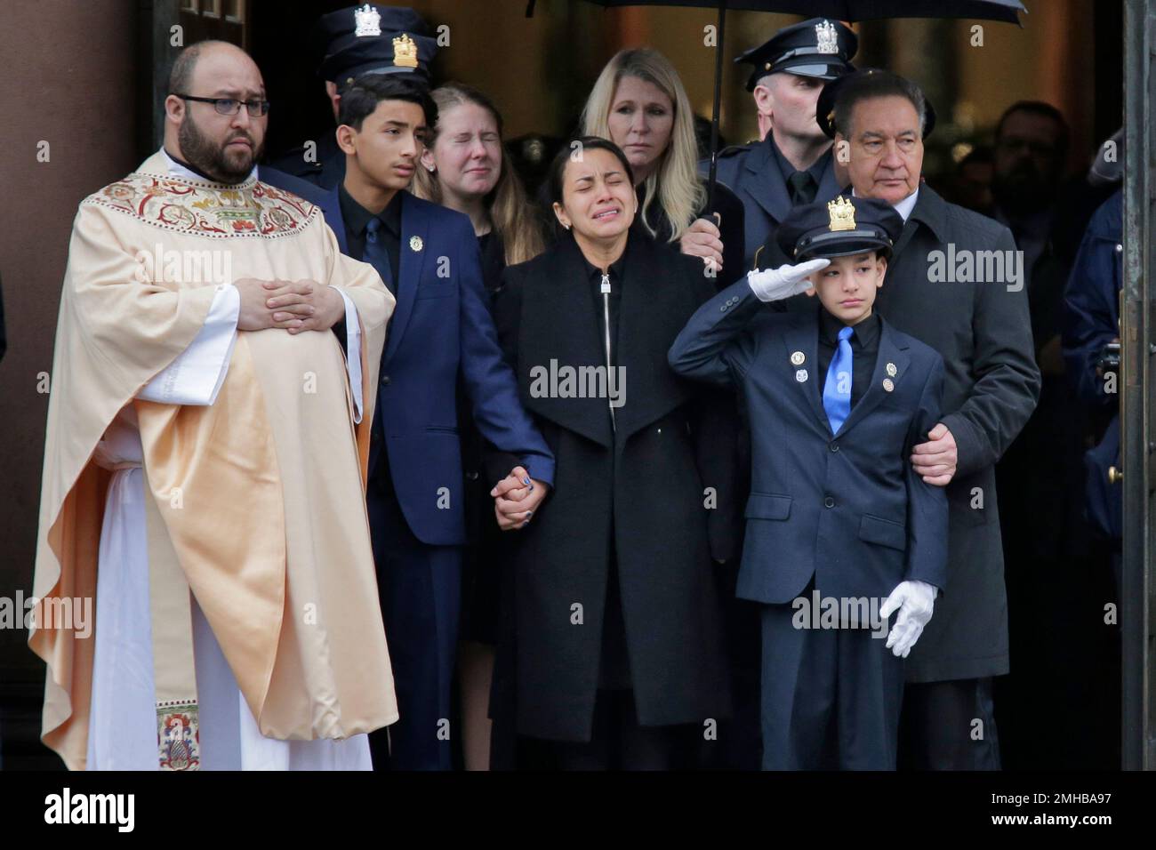 Mourners of Jersey City Police Detective Joseph Seals, including his ...