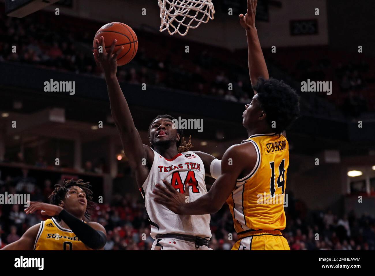 Texas Tech's Chris Clarke (44) lays up the ball around Southern ...