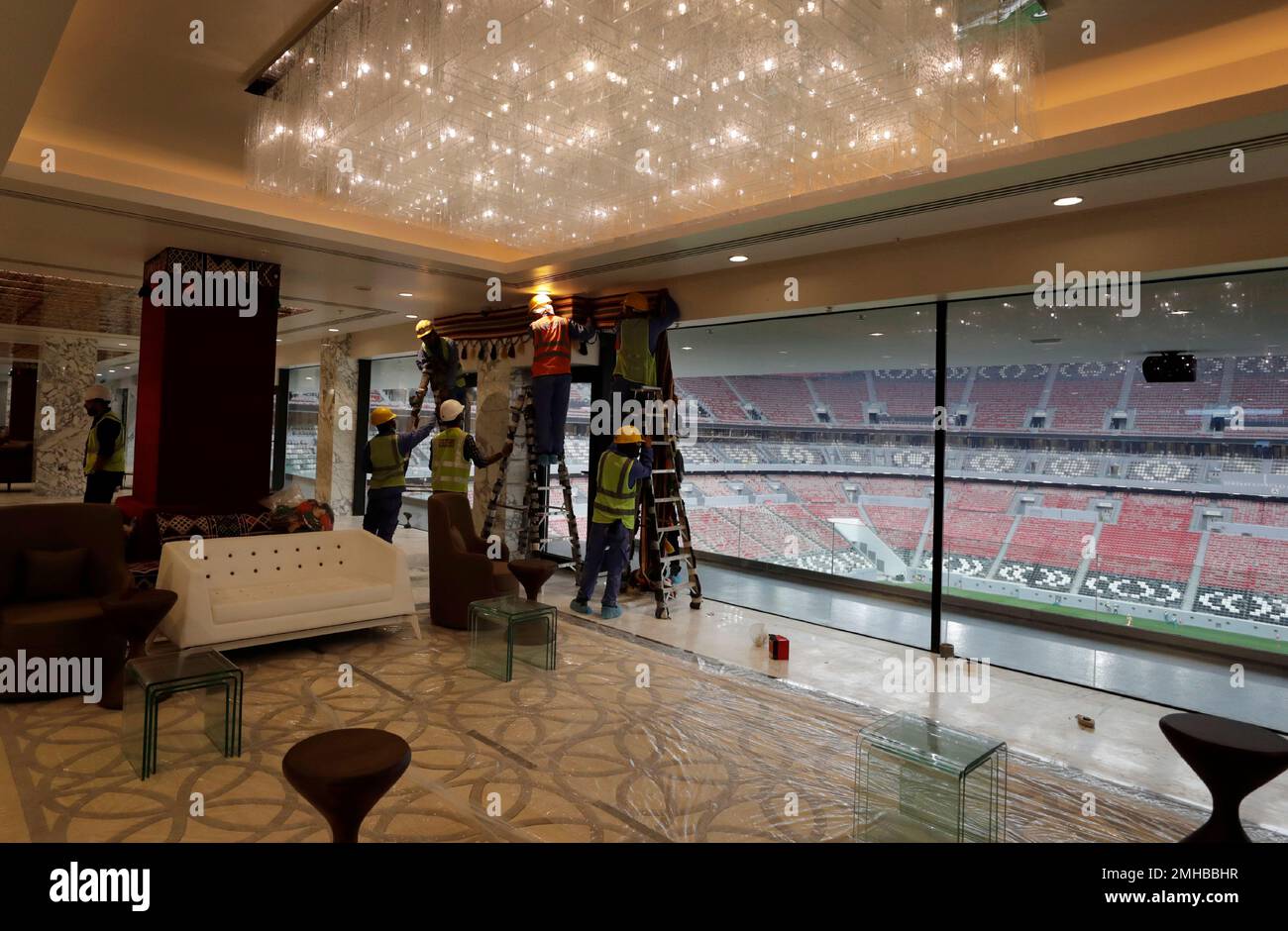 Workers work at the VIP launch of the Al Bayt Stadium, one of the 2022 ...