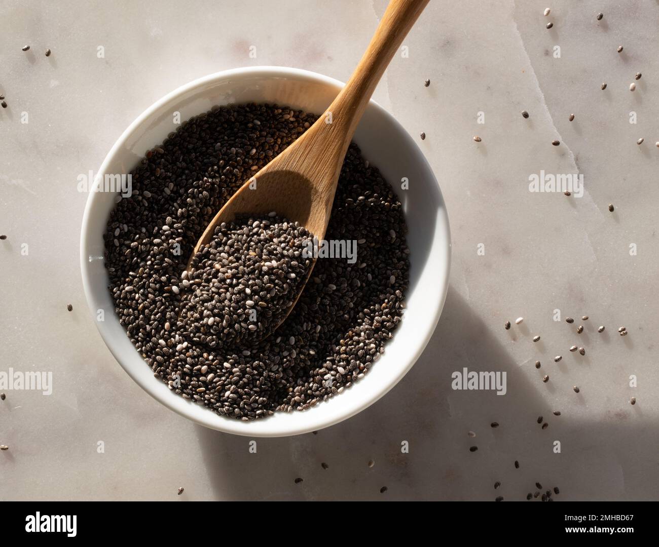 Top down view of a bowl filled with fresh chia seeds, in bright ...