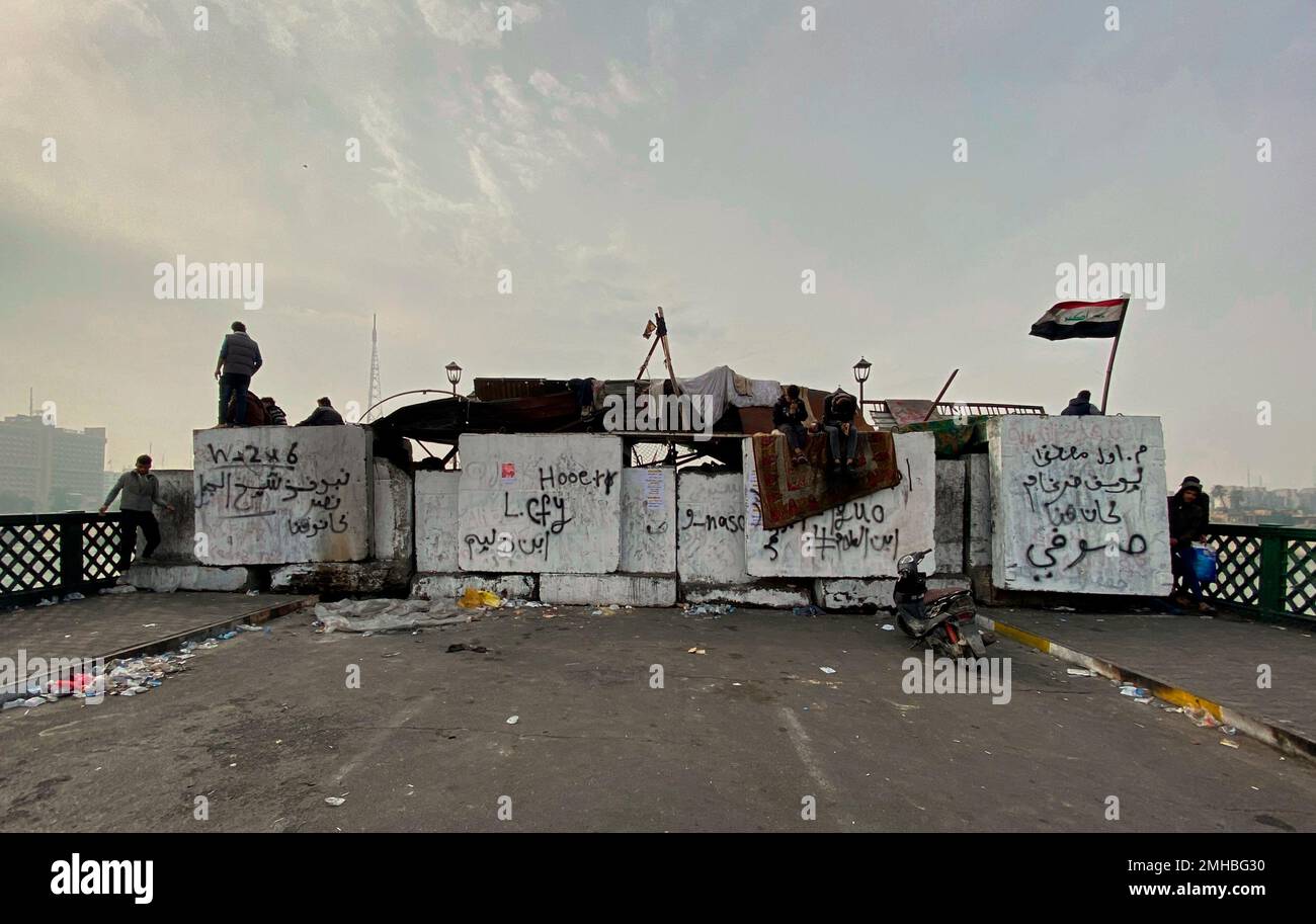 Protesters stage a sit-in at barriers on the Ahrar Bridge during ...