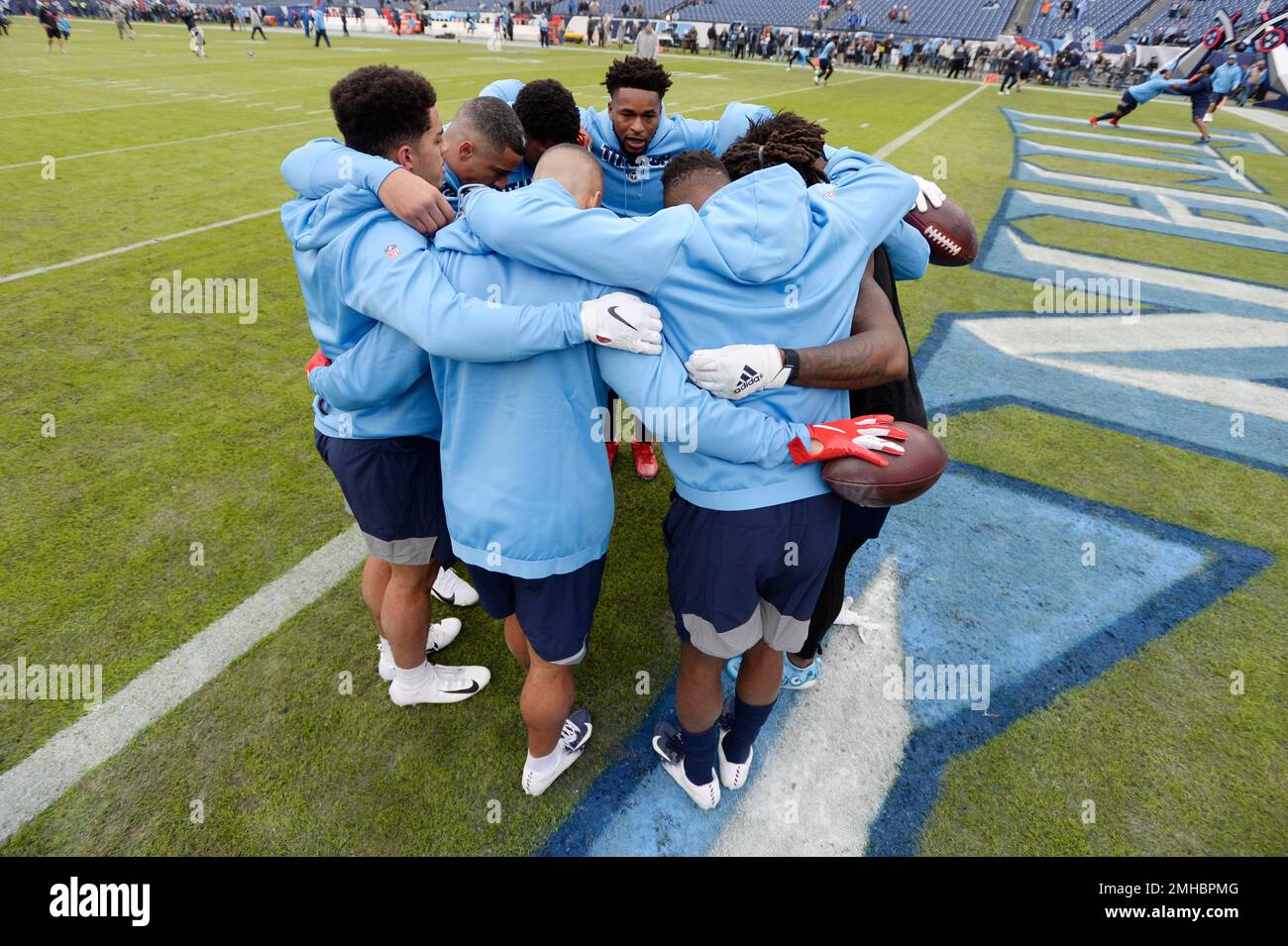 Tennessee Titans players gather together before an NFL football game ...