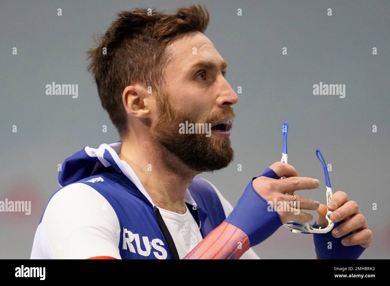 Russia's Alexander Rumyantsev reacts after competing in the men's 5000 meters race of the speed ...