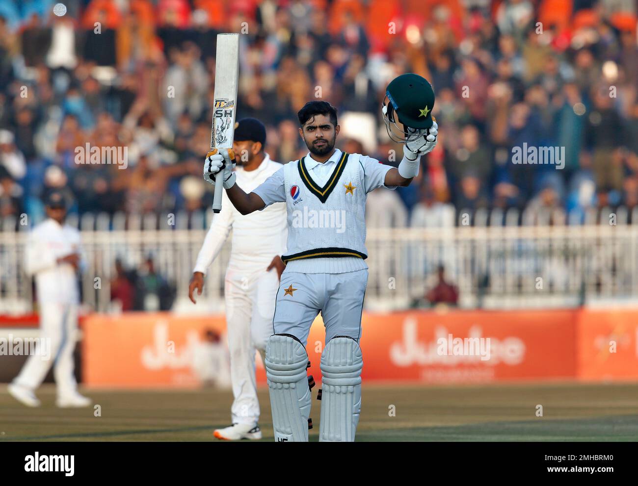 Pakistani batman Babar Azam, left, celebrates after completing his ...