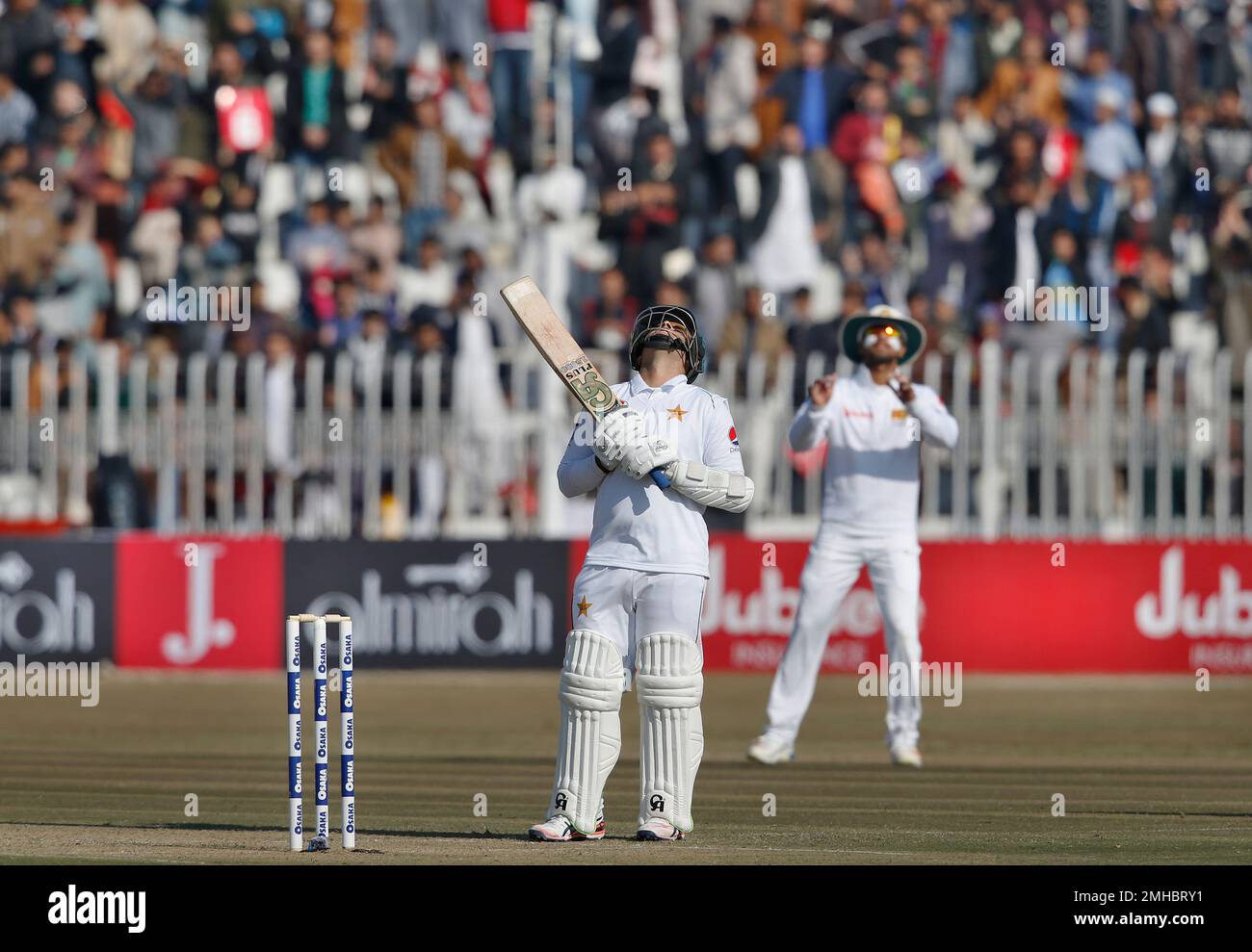 Pakistani batman Abid Ali reacts after completing his fifty during the ...