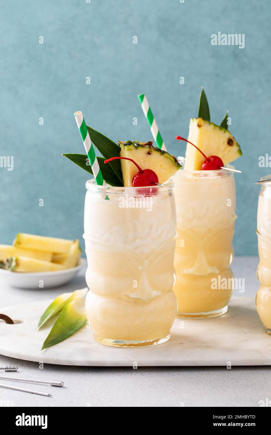 Tropical pina colada cocktail or mocktail in a tiki glass Stock Photo ...