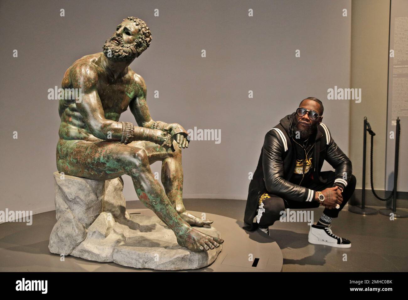 Heavyweight champion Deontay Wilder poses with bronze statue Boxer at ...