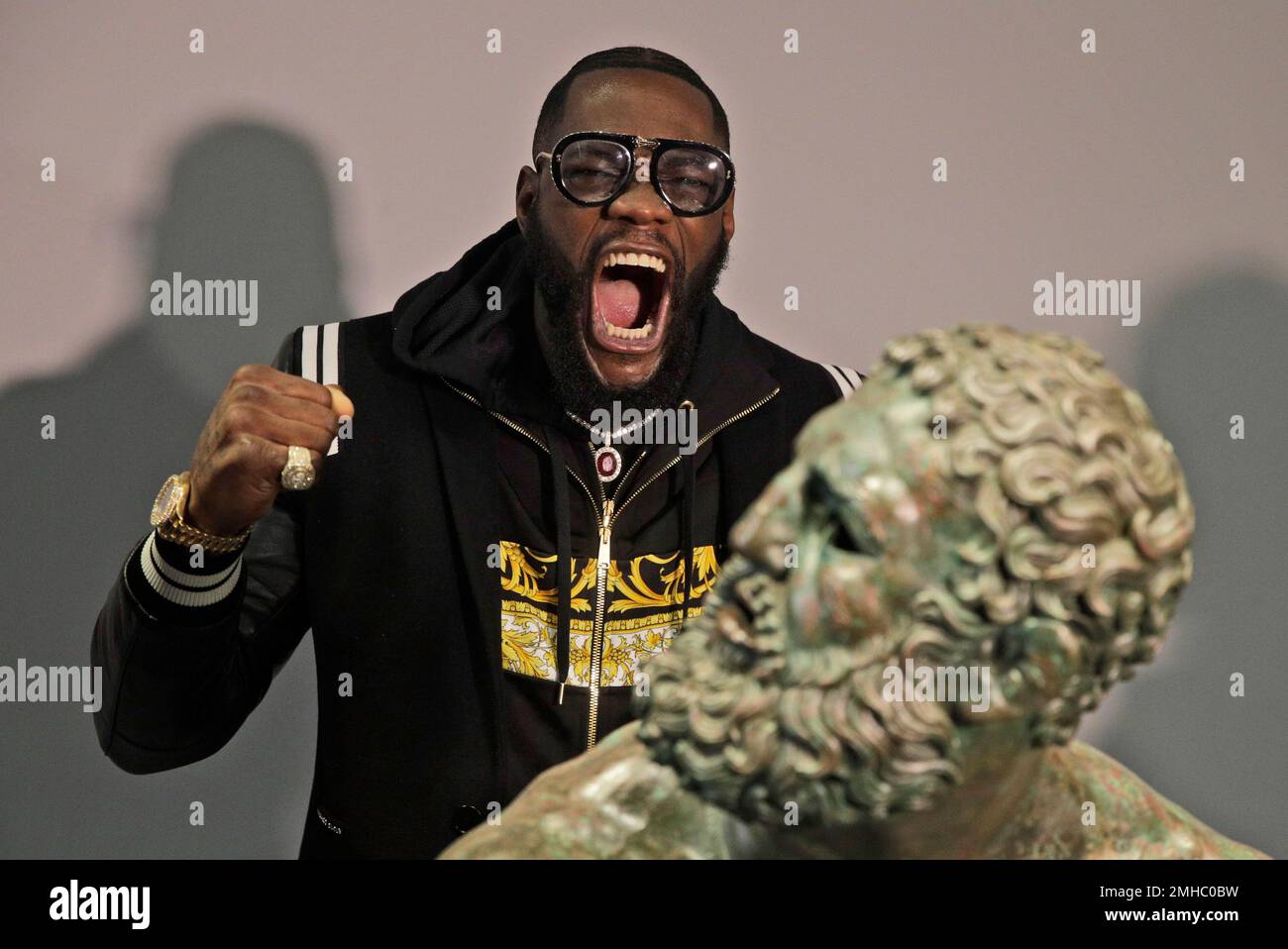 Heavyweight champion Deontay Wilder poses with bronze statue Boxer at ...
