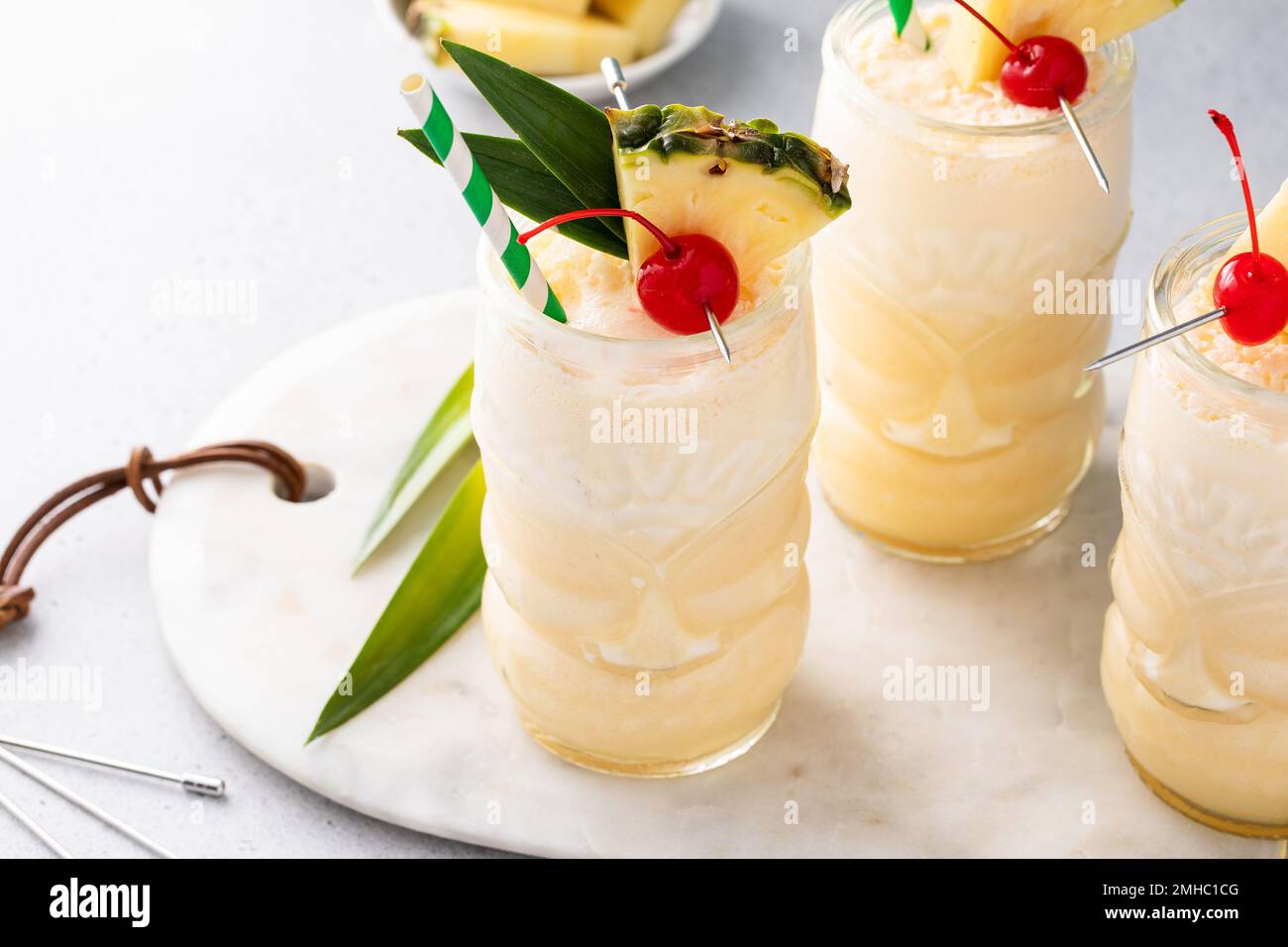 Tropical pina colada cocktail or mocktail in a tiki glass Stock Photo ...