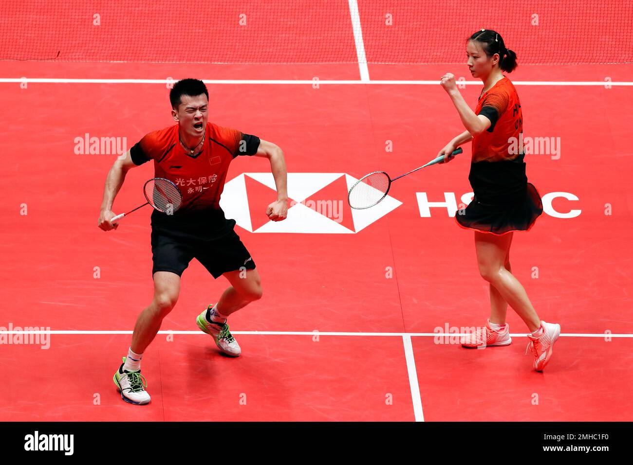 China's Zheng Si Wei, left, and his teammate Huang Ya Qiong celebrates ...