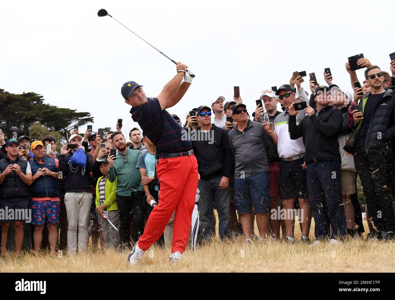 U.S. team player Patrick Reed plays from the rough on the 15th hole in ...