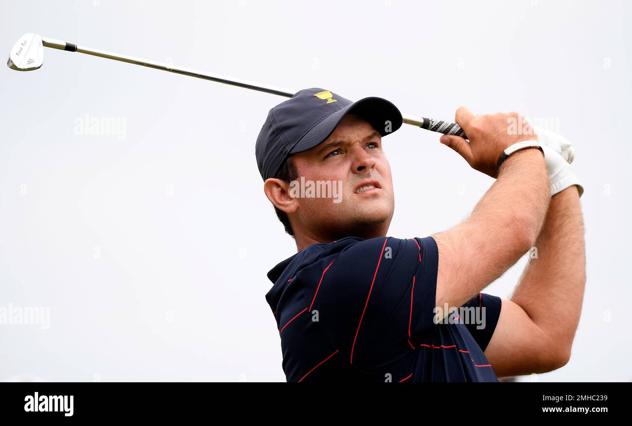 U.S. team player Patrick Reed hits on the 14th hole in their fourball ...