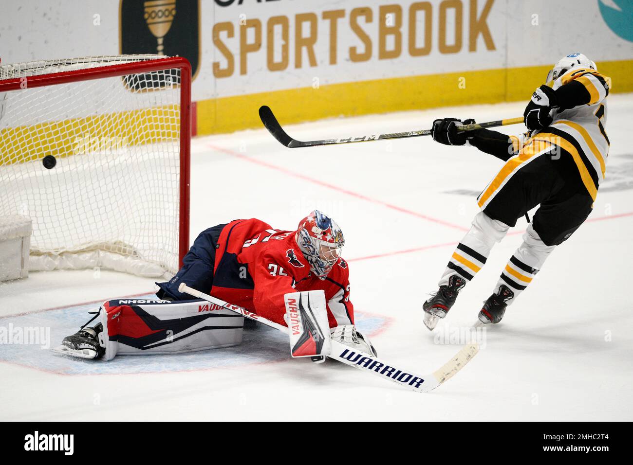 Pittsburgh Penguins right wing Rickard Rakell, right, scores against ...