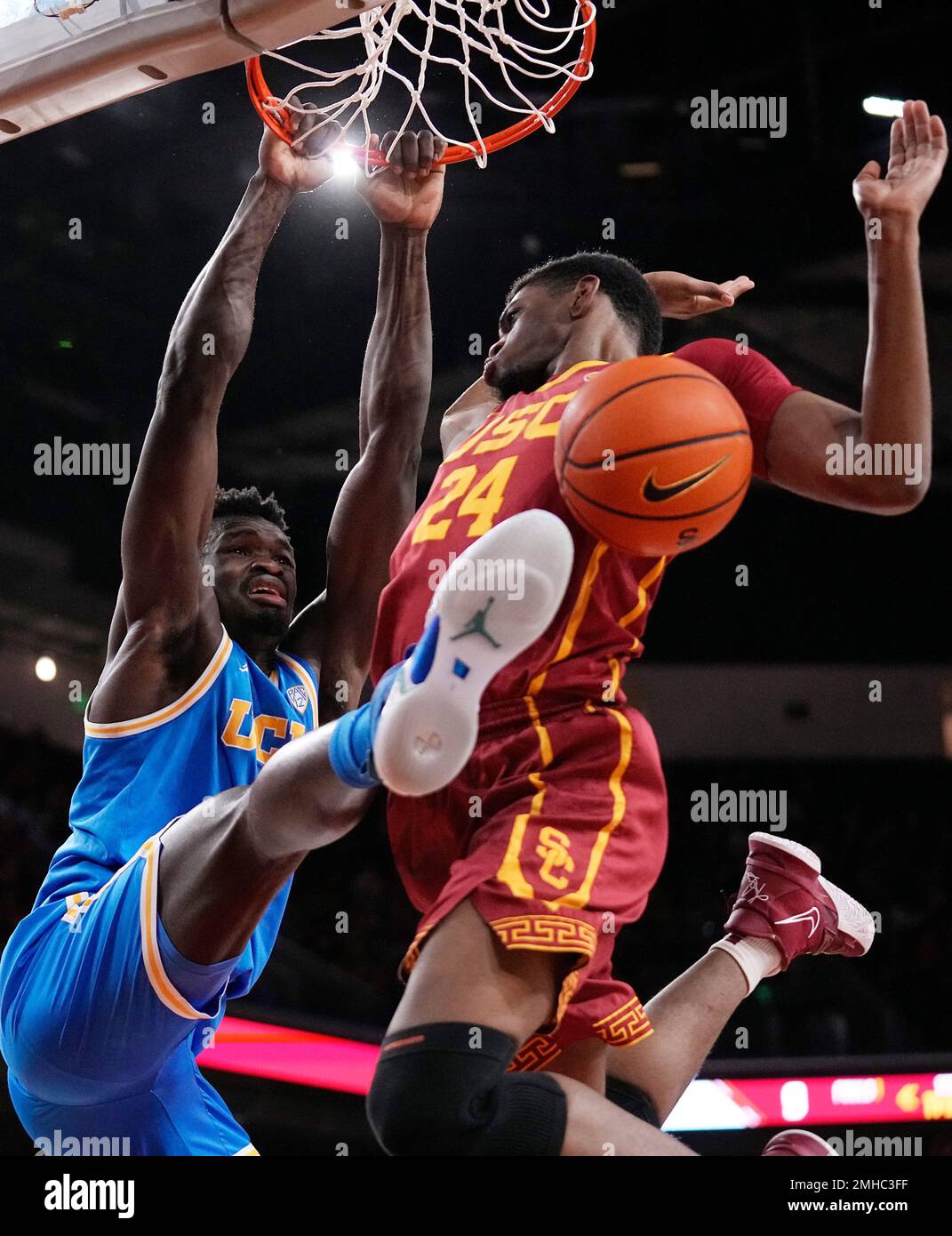 UCLA forward Adem Bona, left, dunks as Southern California forward ...