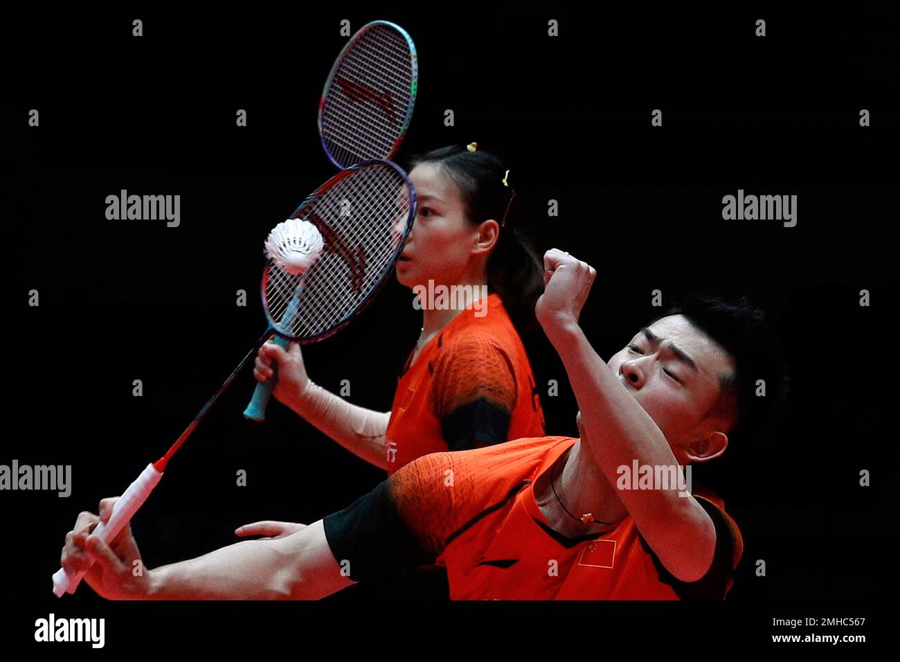 China's Zheng Si Wei, right, hits a return shot next to his teammate ...