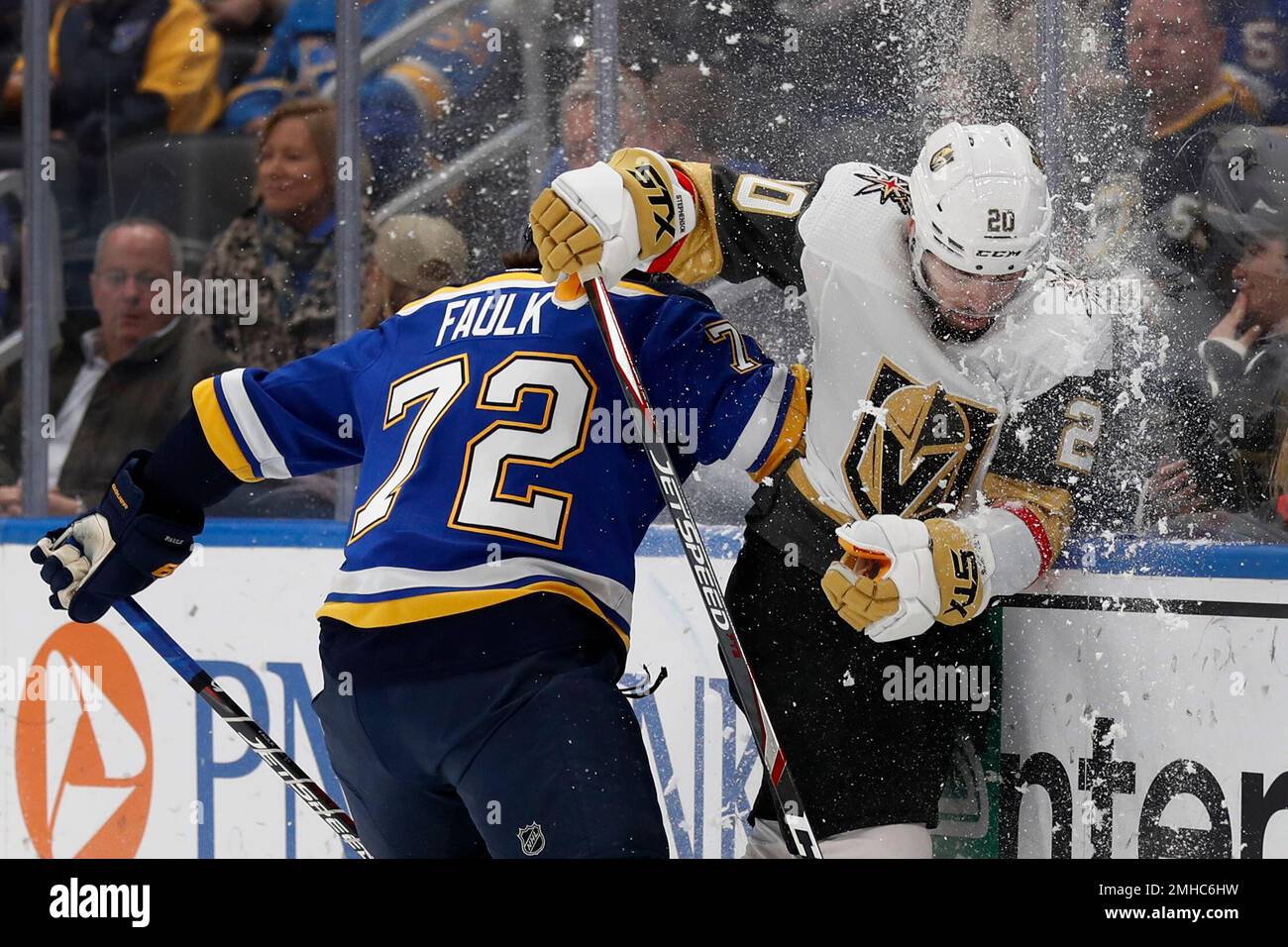 St. Louis Blues' Justin Faulk (72) checks Vegas Golden Knights ...