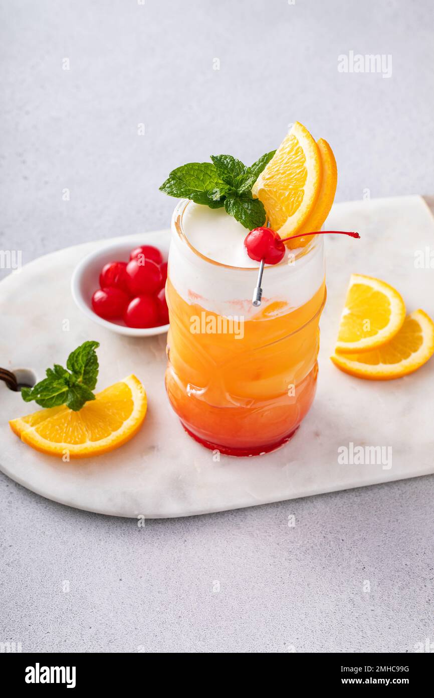 Zombie tropical cocktail with rum in tiki glasses Stock Photo - Alamy