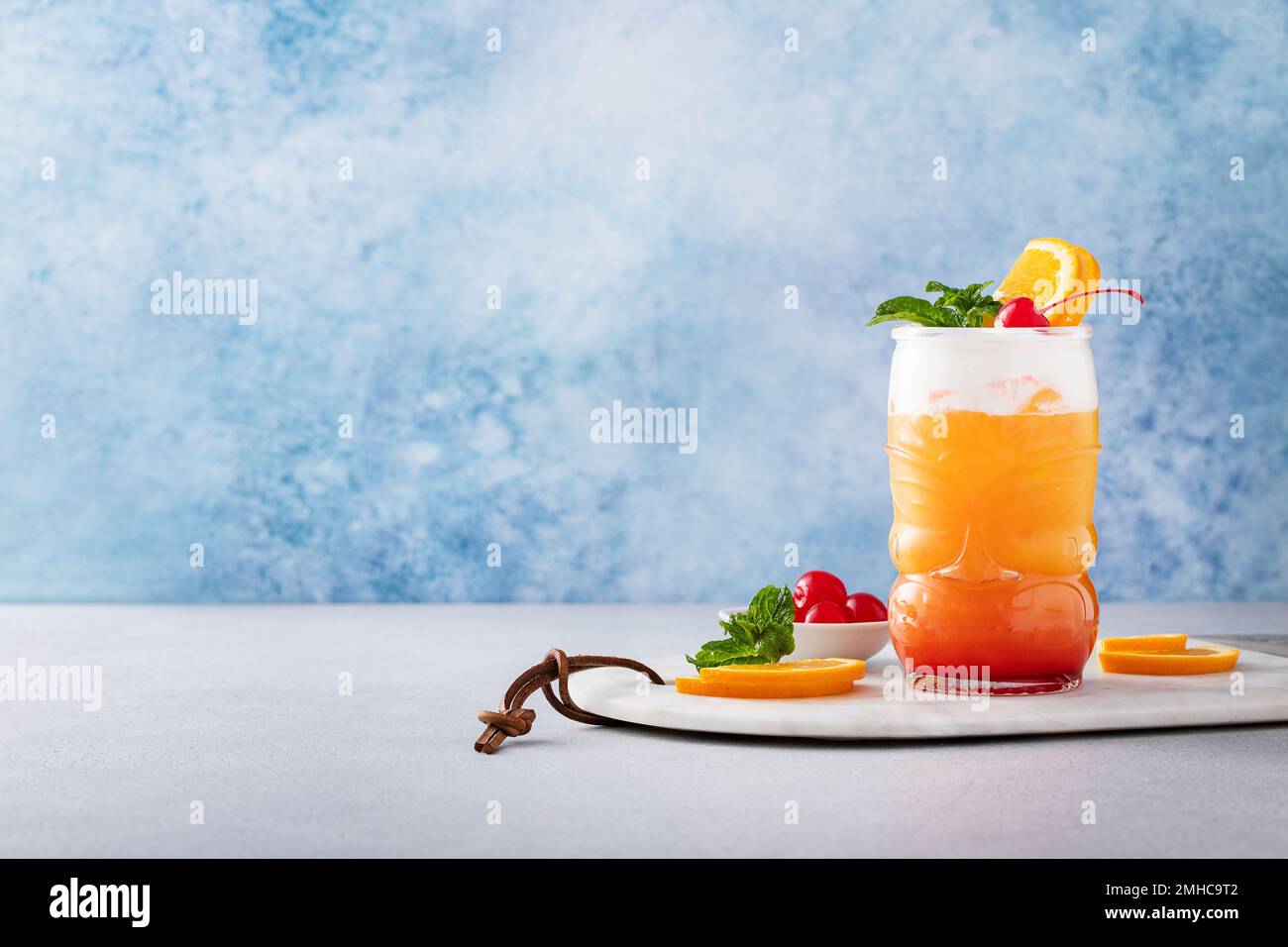 Zombie tropical cocktail with rum in tiki glasses Stock Photo - Alamy