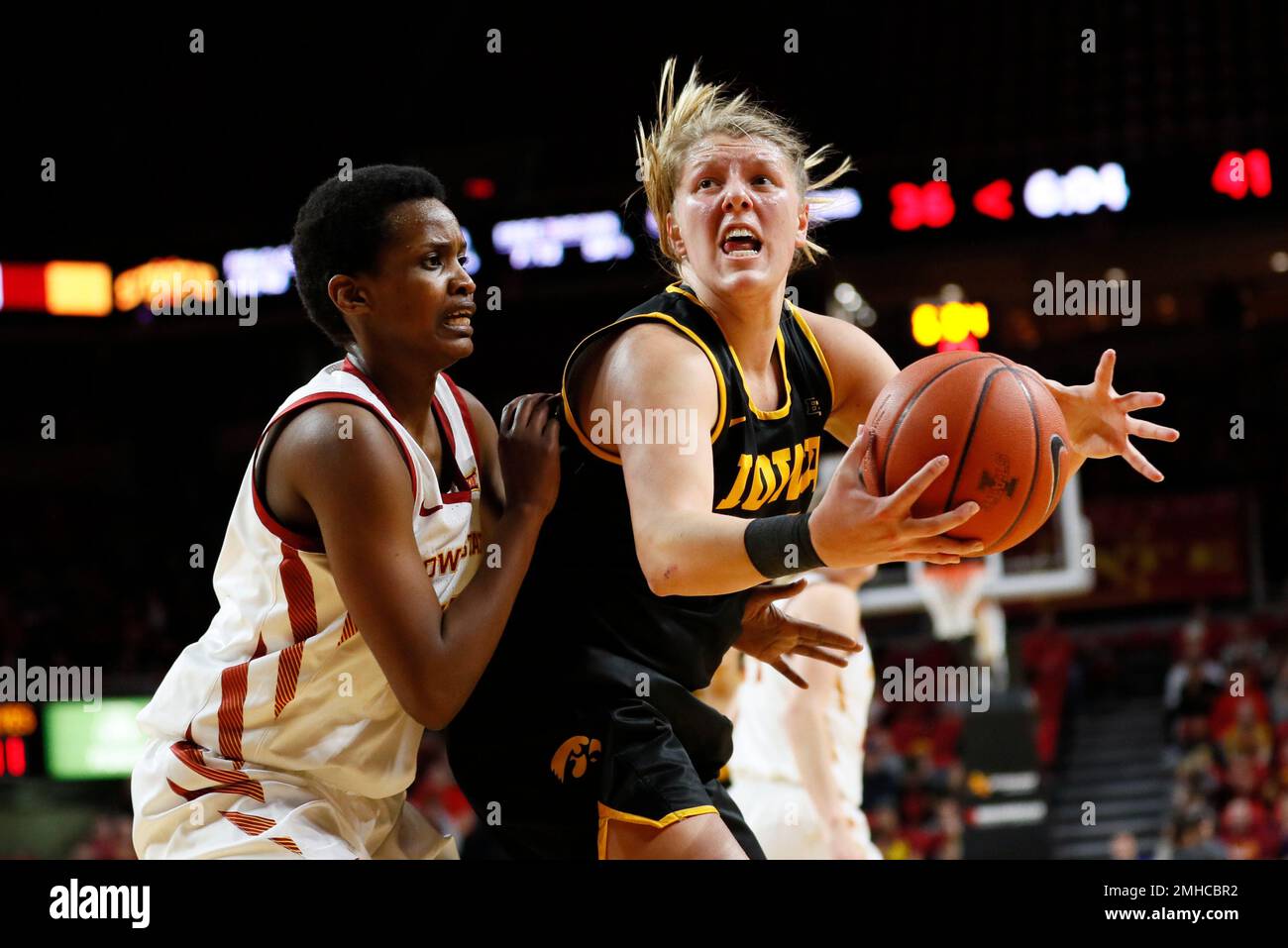 Iowa forward Monika Czinano drives to the basket past Iowa State ...