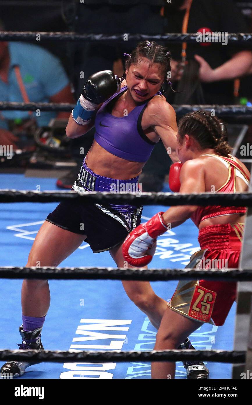Louisa Hawton (left) delivers punch to Lorraine Villalobos during the ...
