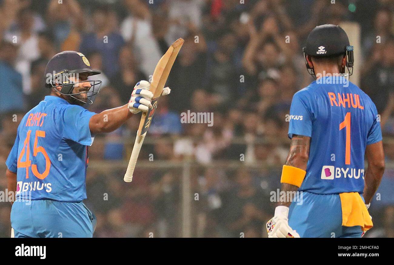 India's Rohit Sharma, left, raises his bat after scoring 50 runs during ... India's Rohit Sharma, left, raises his bat after scoring 50 runs during ...