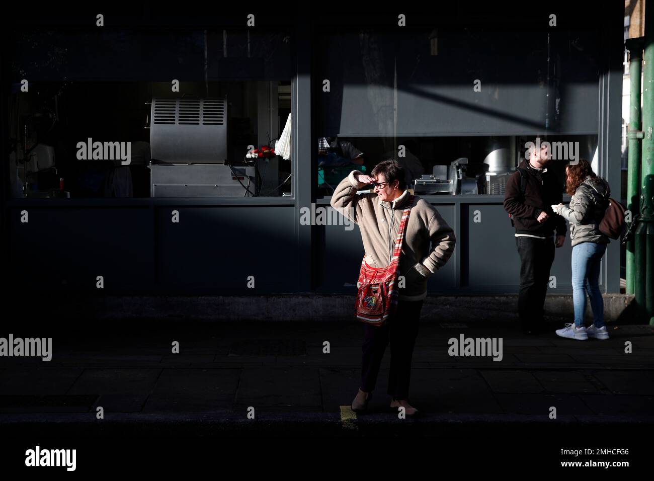 People stand outside a bakery at Borough Market in London, Wednesday ...