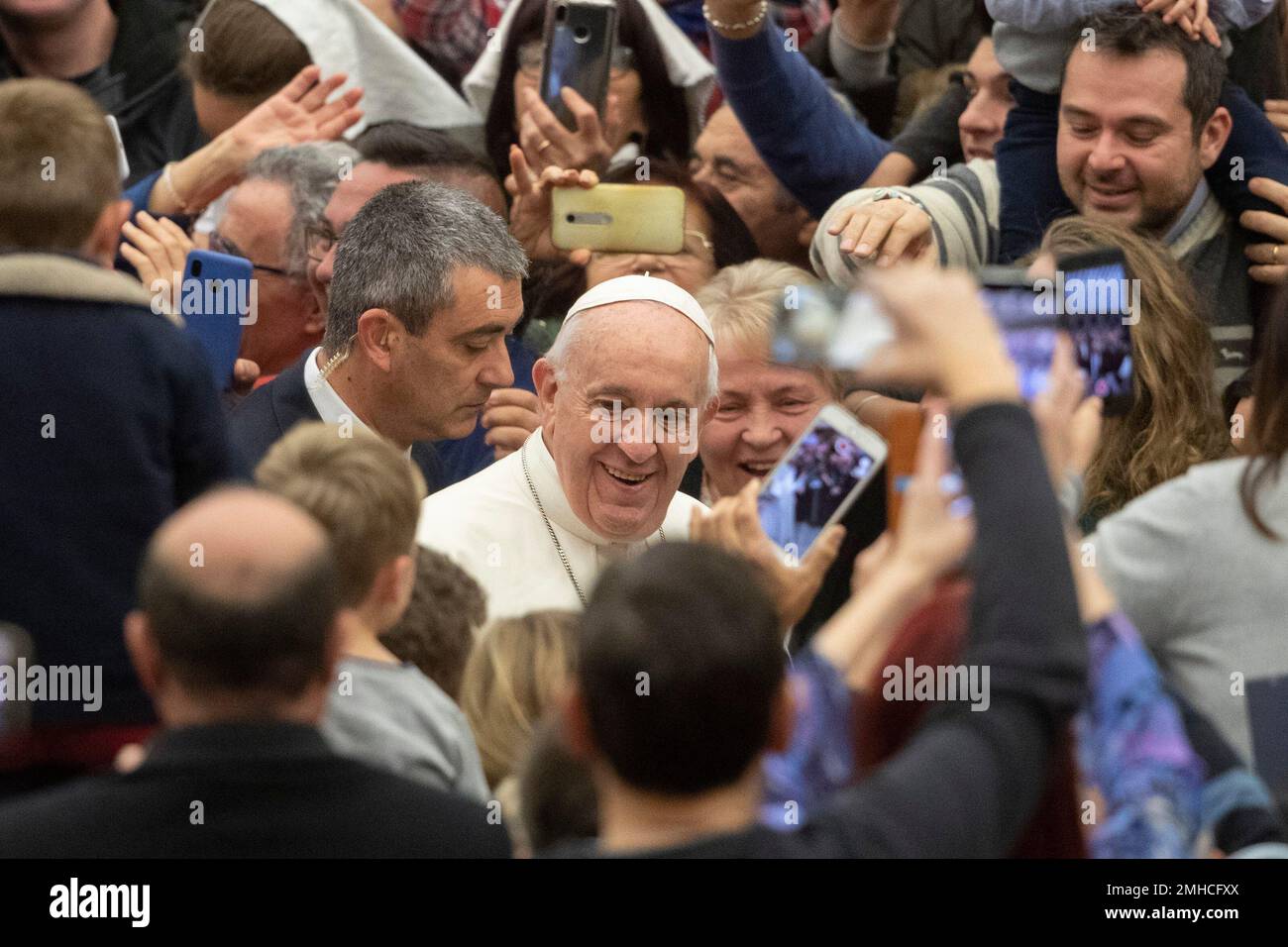 Pope Francis arrives in the Paul VI Hall at the Vatican for his weekly ...