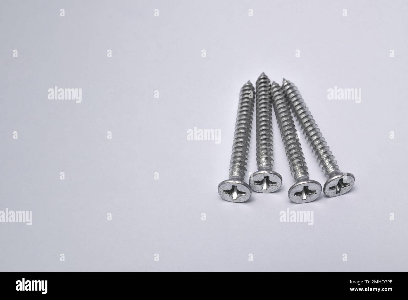 Close-up on screws, metal screws, iron screws, isolated on whited ...