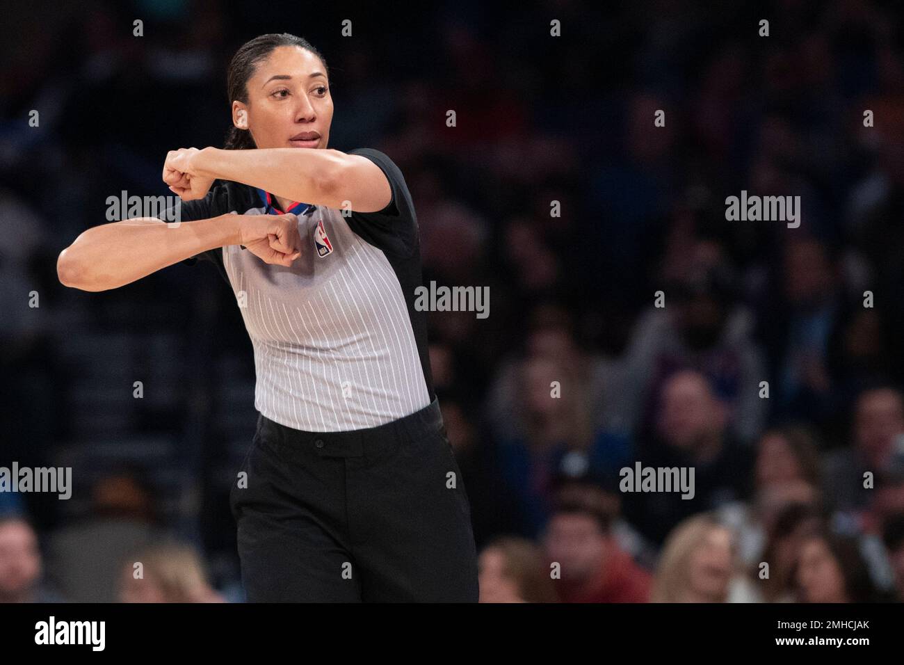Referee Simone Jelks signals in the first half of an NBA basketball ...