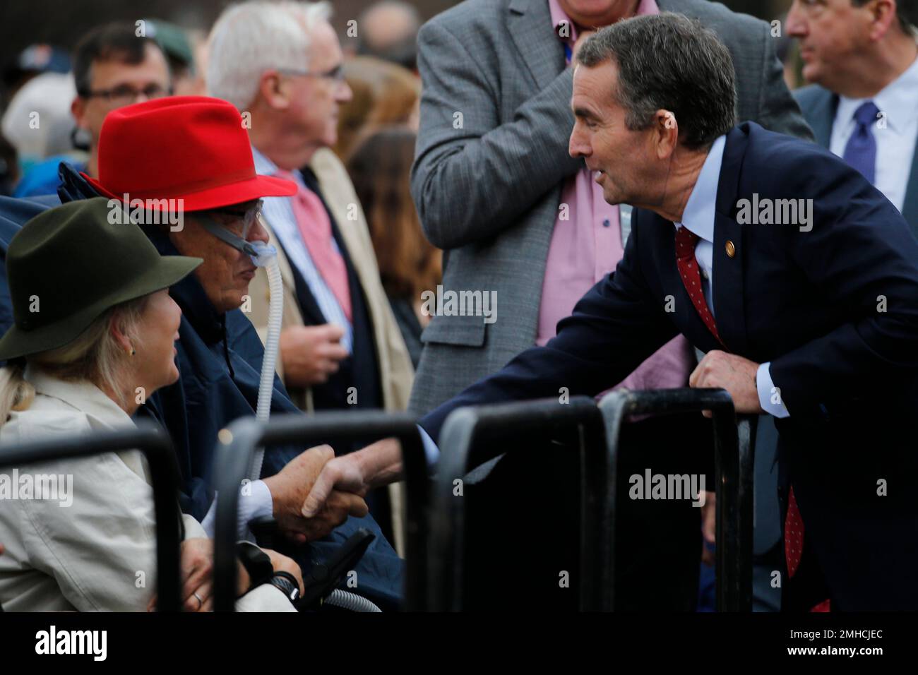 Virginia Gov. Ralph Northam, right, greets Pam Royall and Bill Royall ...