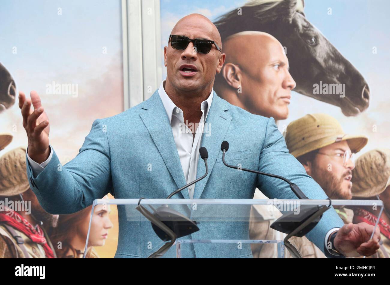 Dwayne Johnson speaks during a hand and footprint ceremony honoring ...