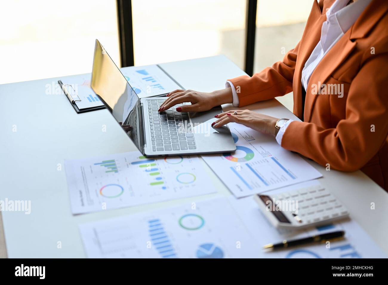 Professional Asian businesswoman or female CEO using laptop computer ...