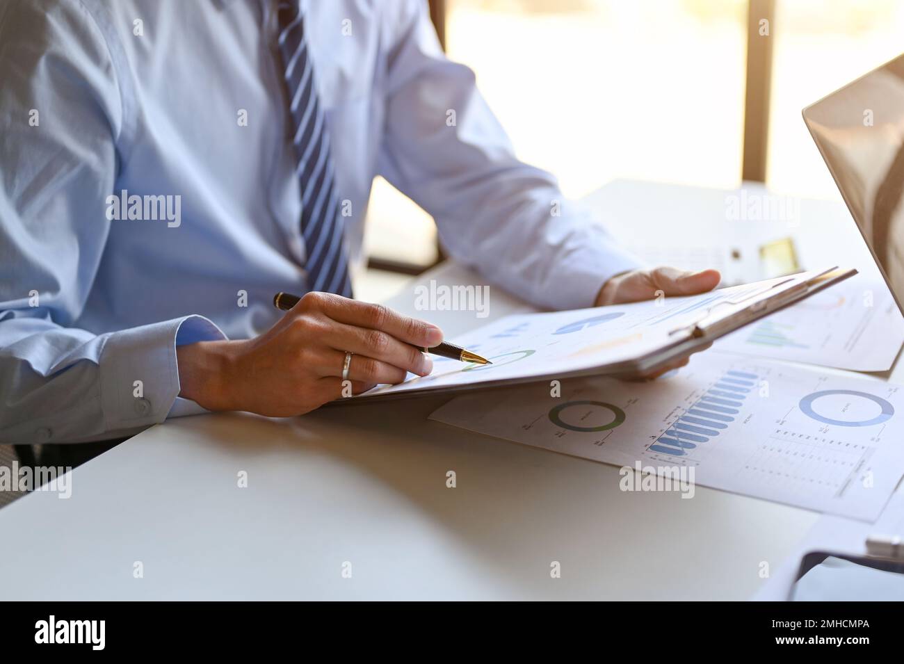 Professional Asian male financial consultant or businessman analyzing ...