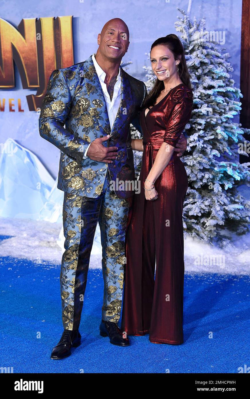 Dwayne Johnson, left, arrives with Lauren Hashian at the Los Angeles ...