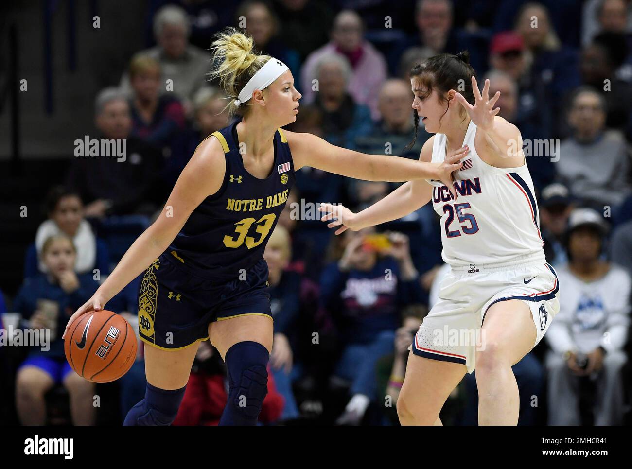 Notre Dame's Sam Brunelle, left, is guarded by Connecticut's Kyla Irwin ...