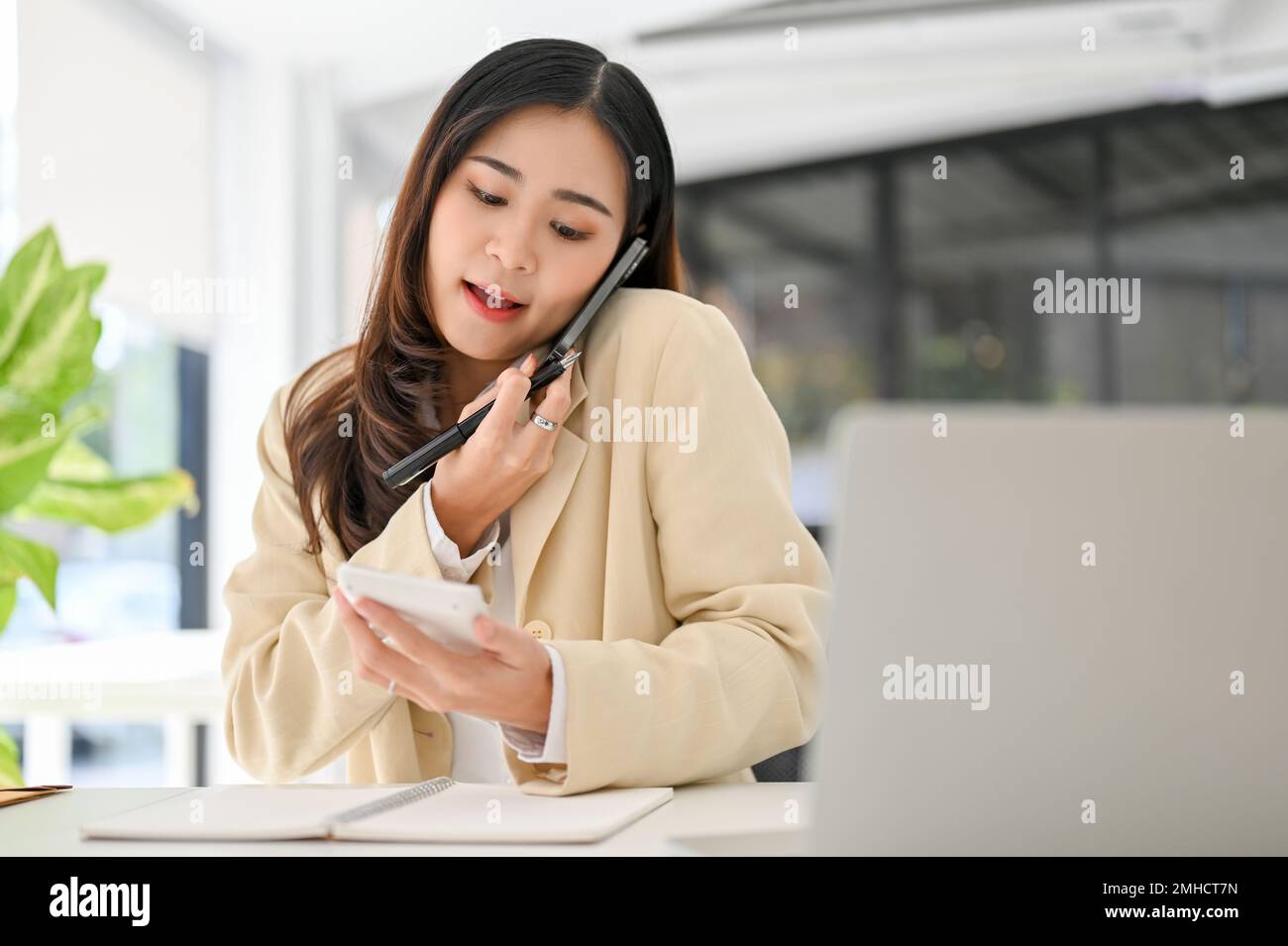 Professional and busy millennial Asian businesswoman or female ...