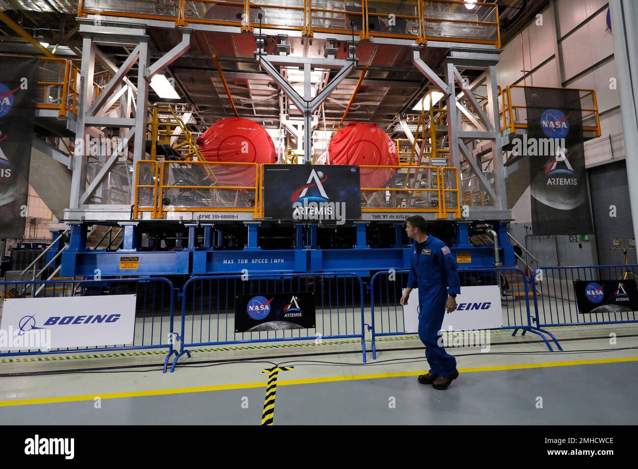 NASA astronaut Matt Dominick walks past NASA's Space Launch System (SLS ...