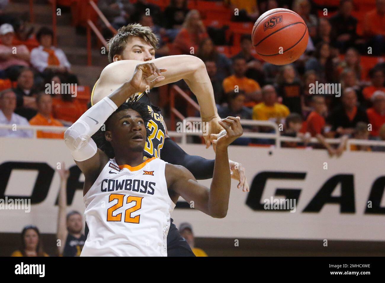 Oklahoma State forward Kalib Boone (22) and Wichita State center ...
