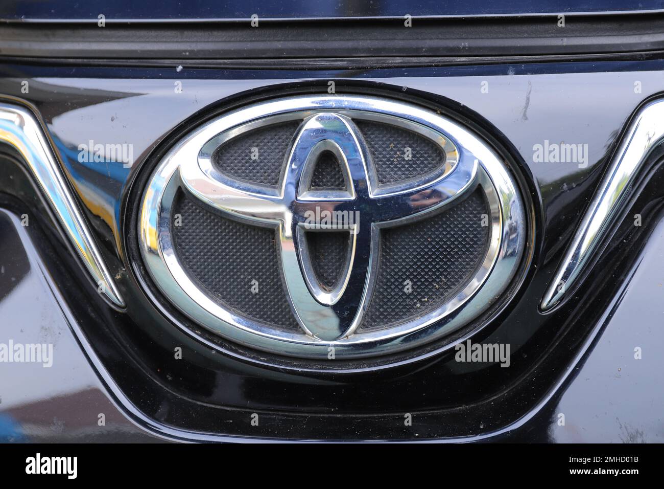 Toyota logo close up. Toyota car in the showroom Stock Photo - Alamy