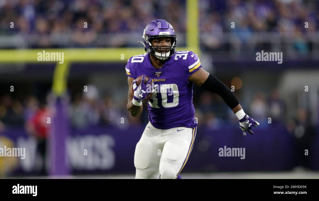 Minnesota Vikings fullback C.J. Ham carries the ball up field during ...
